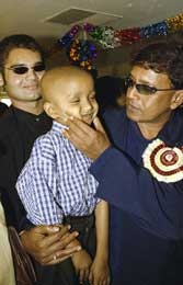 Mithunda with eldest son Mimoh in the background / Mithun Chakraborty ...