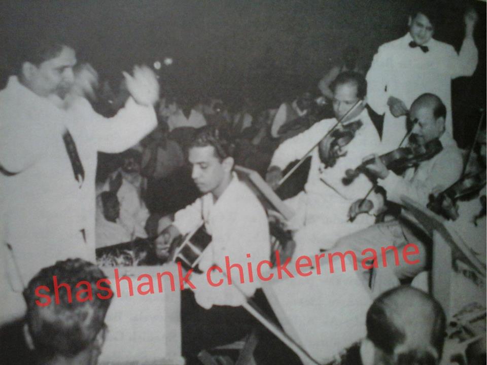 Shankar Jaikishan directing musicians in a song recording / Shankar ...
