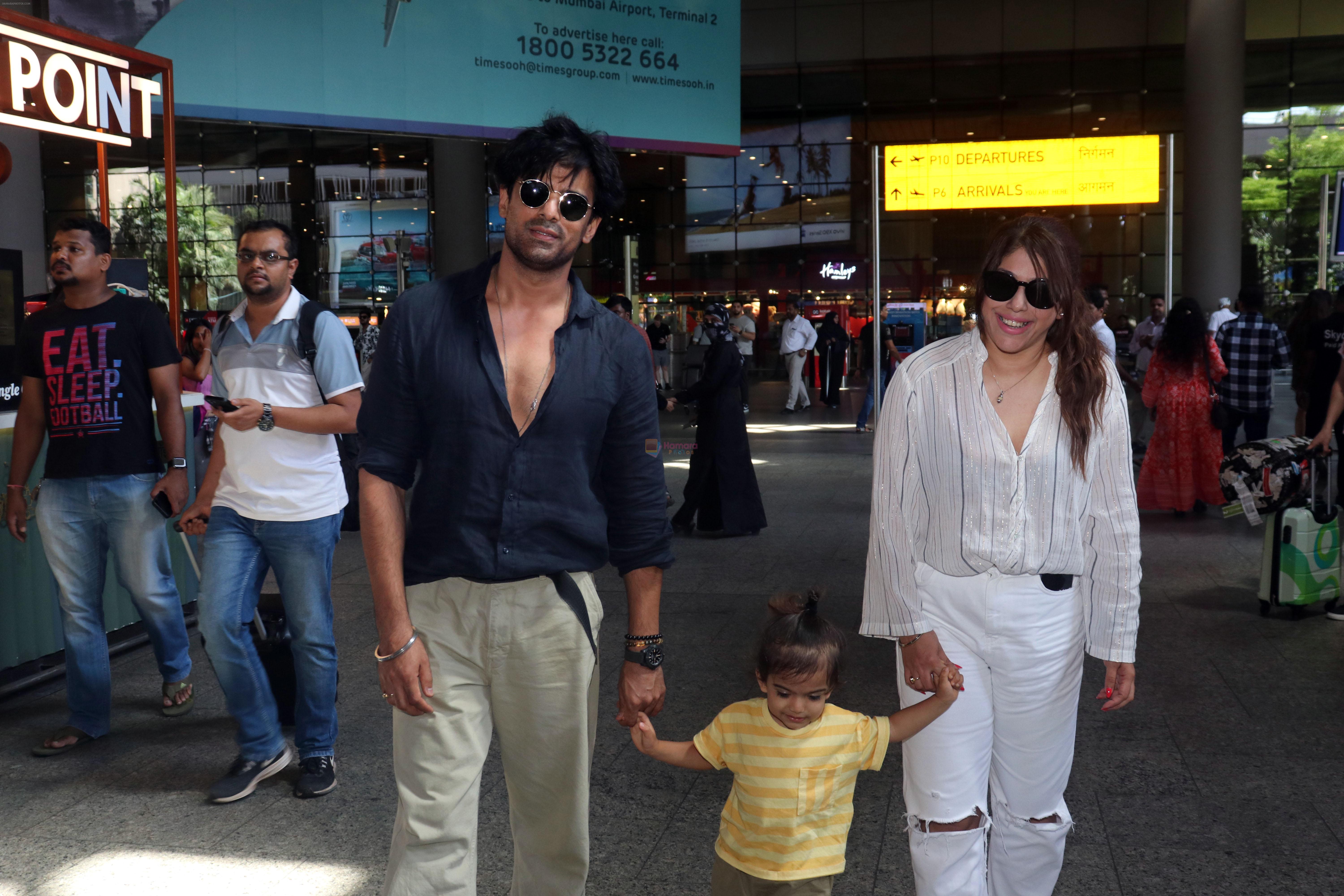 Addite Malik, Mohit Malik along with their child at the aiport on 20th ...