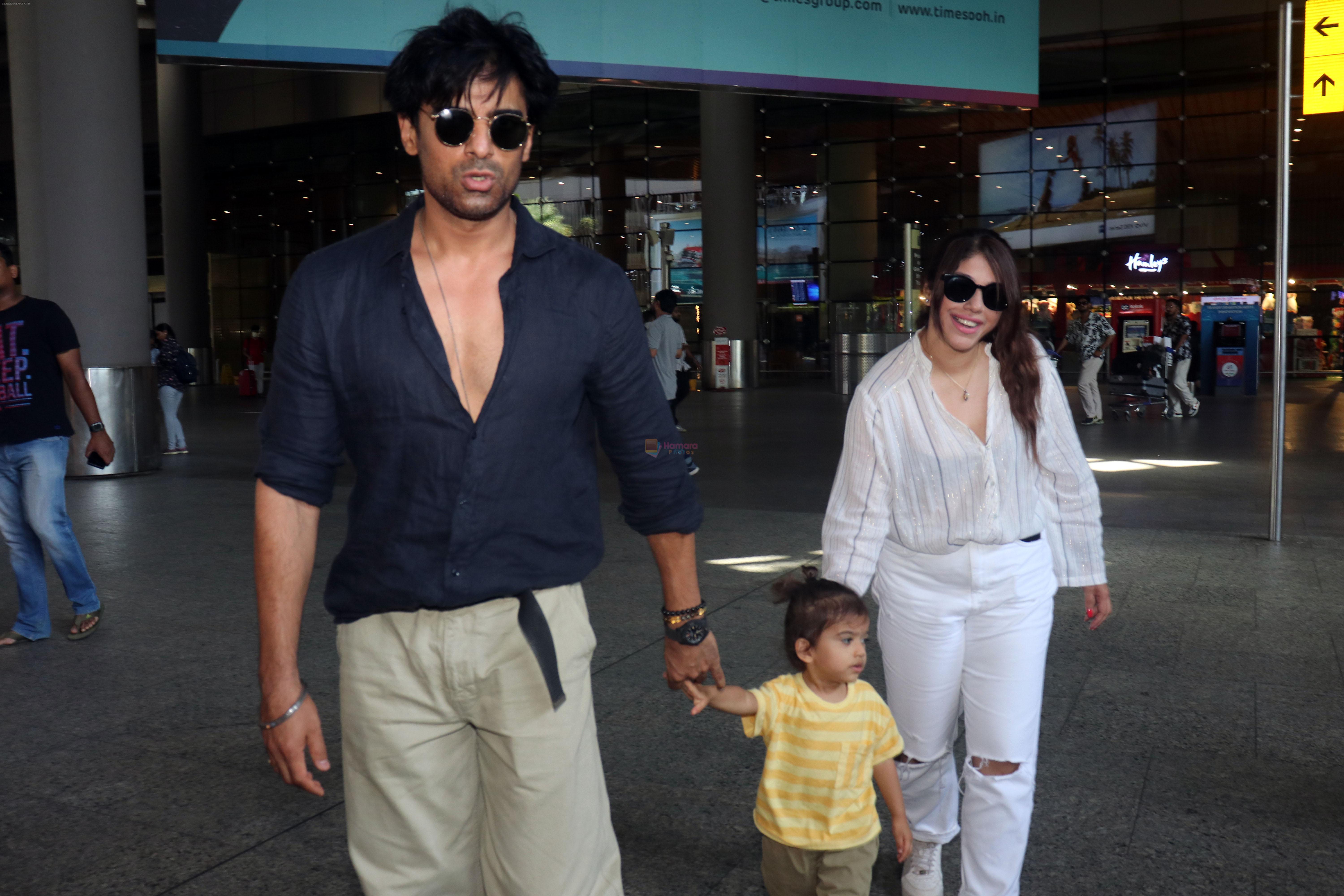Addite Malik, Mohit Malik along with their child at the aiport on 20th ...