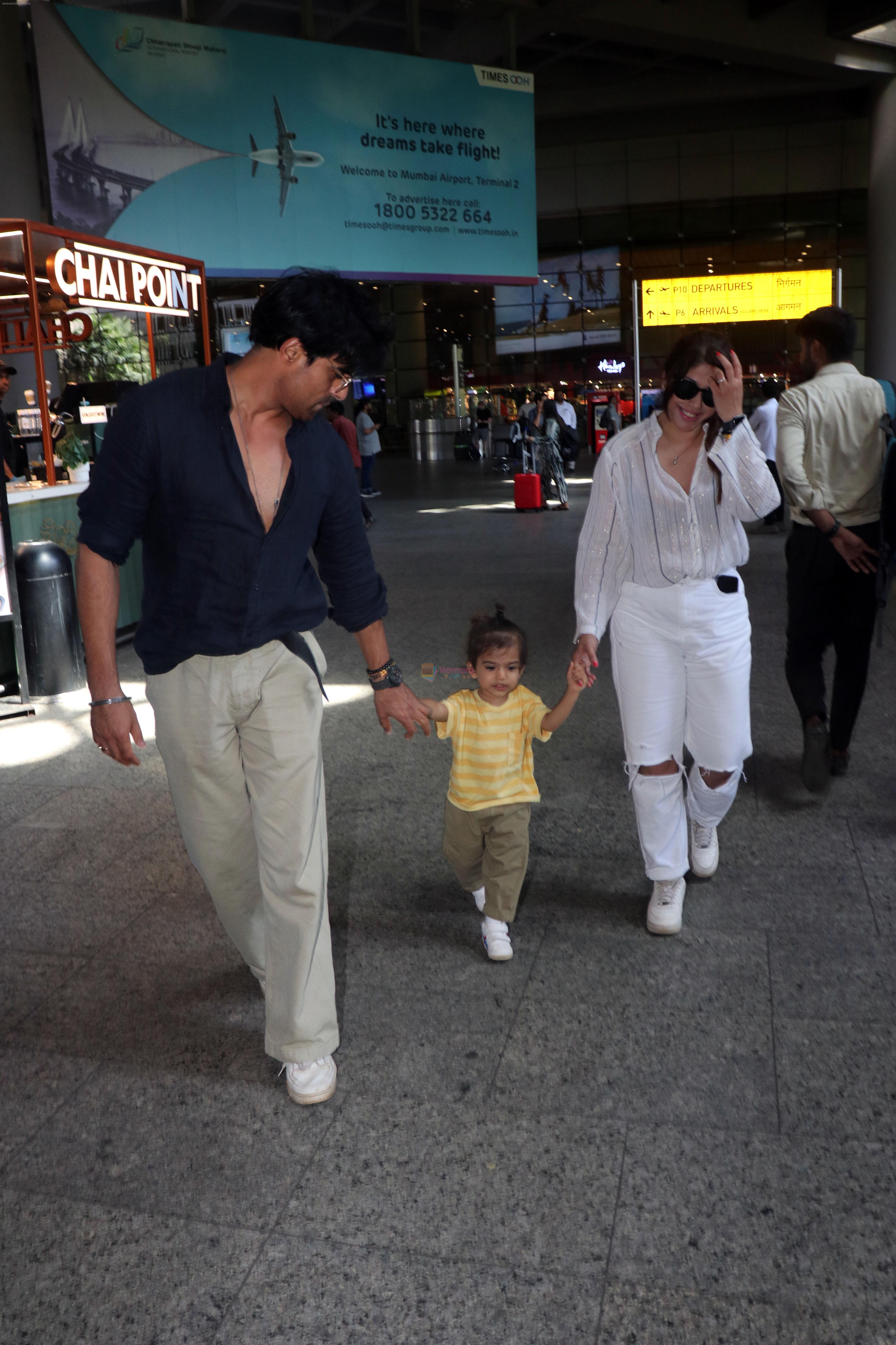 Addite Malik, Mohit Malik along with their child at the aiport on 20th ...