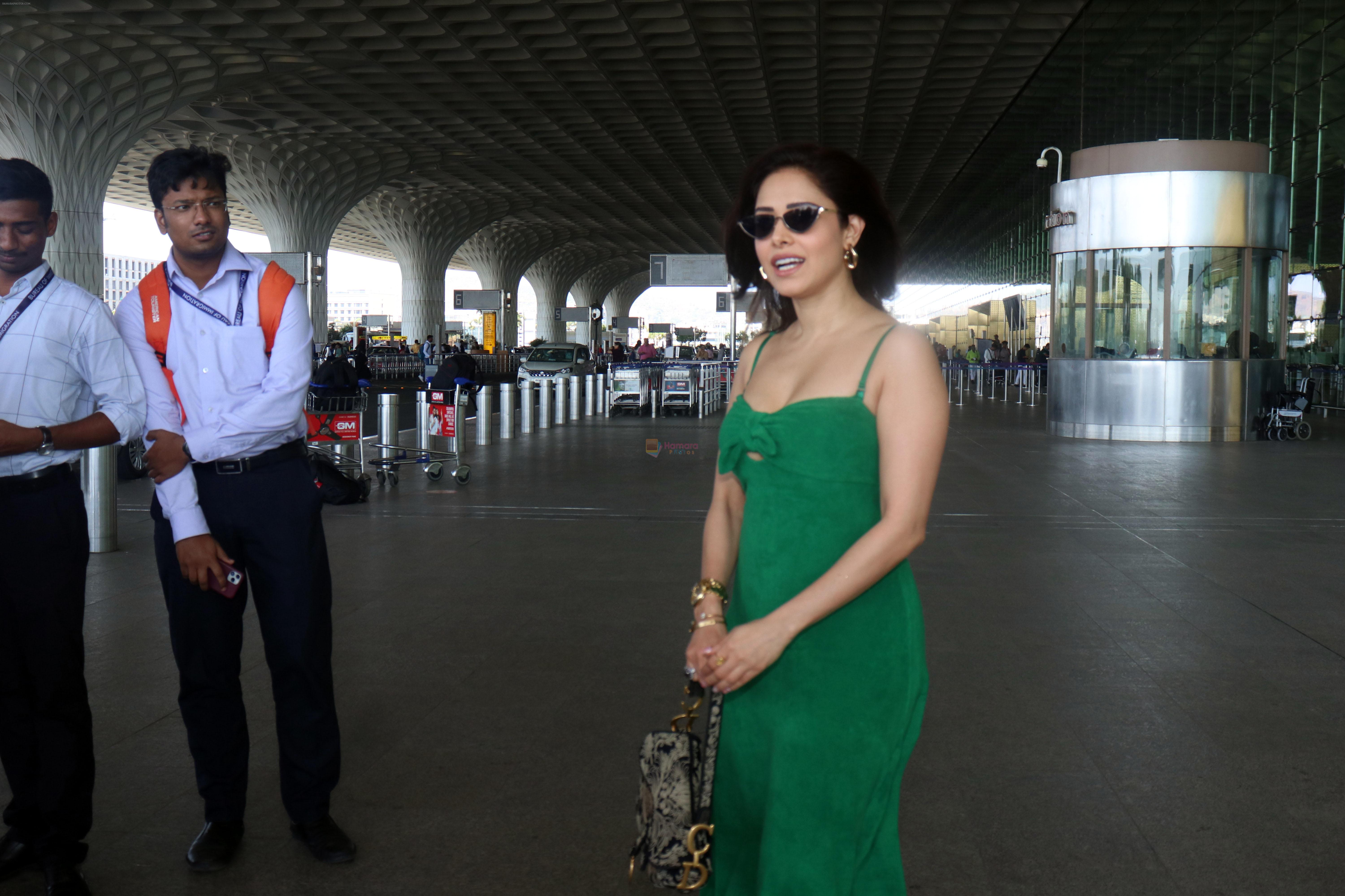 Nushrratt Bharuccha in shoulderless green dress with a tie knot wearing ...