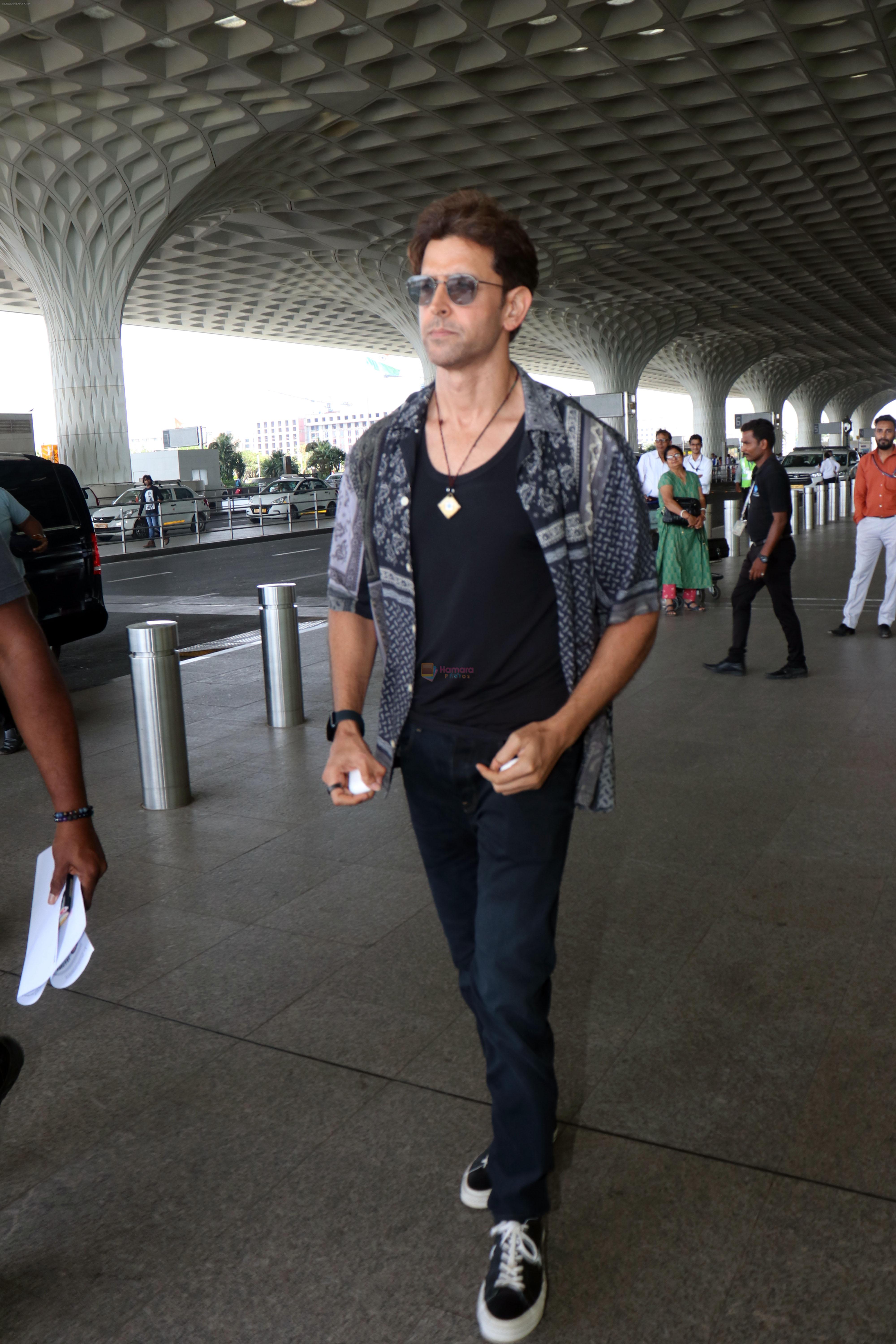 Hrithik Roshan in black teas unbuttoned shirt dark blue jeans and ...