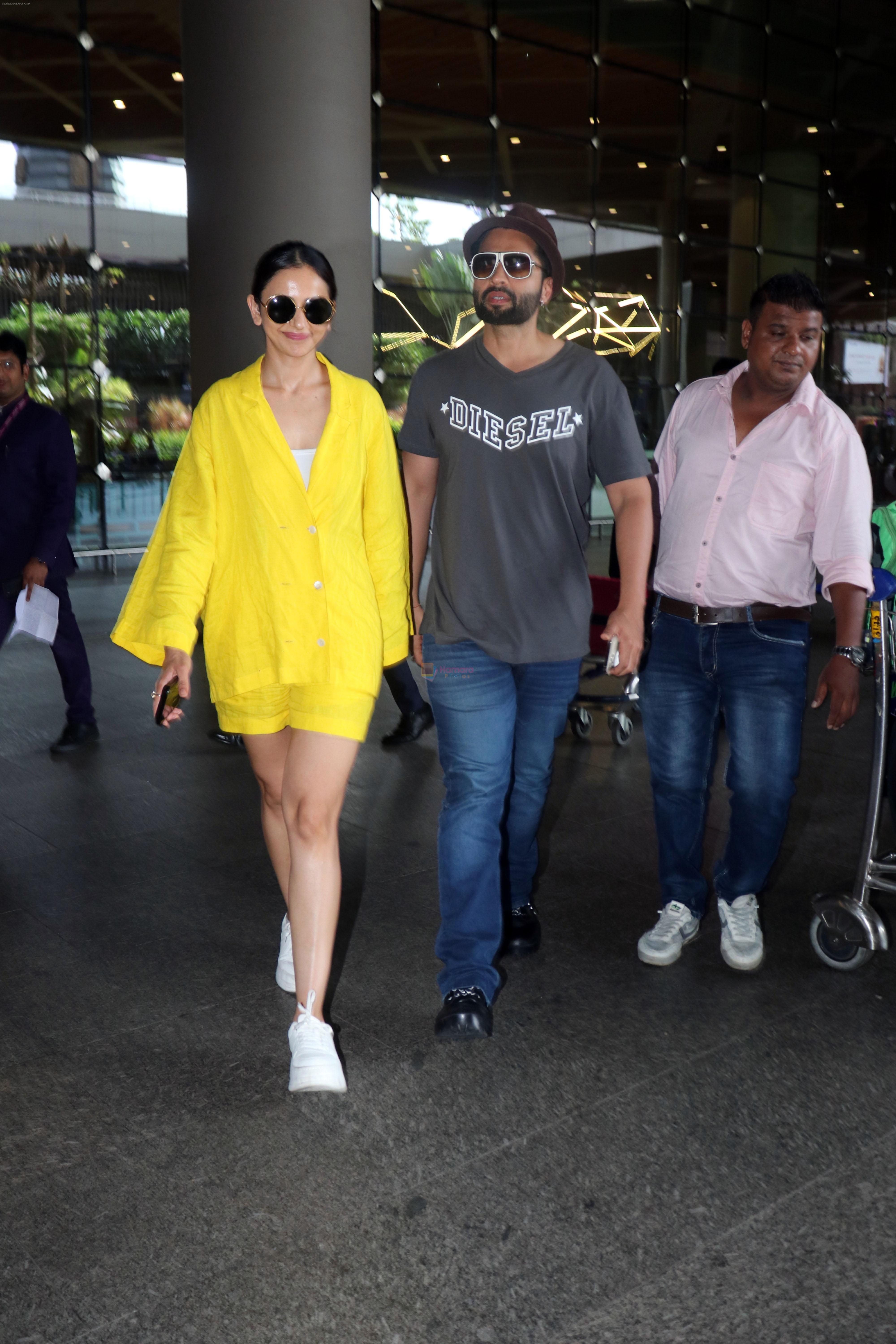 Rakul Preet Singh dressed in yellow Kiara Jacket and Jackky Bhagnani in ...