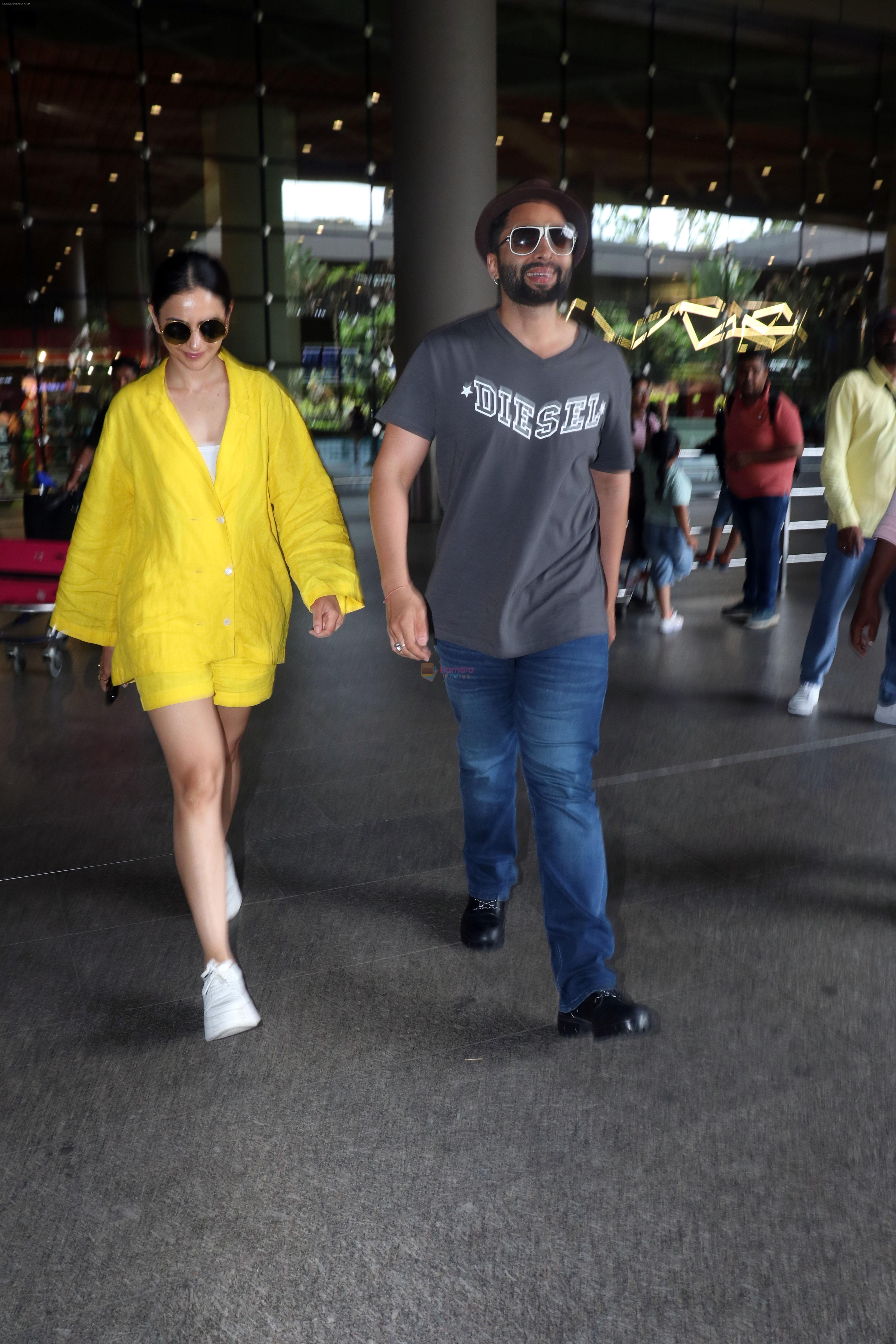 Rakul Preet Singh dressed in yellow Kiara Jacket and Jackky Bhagnani in ...