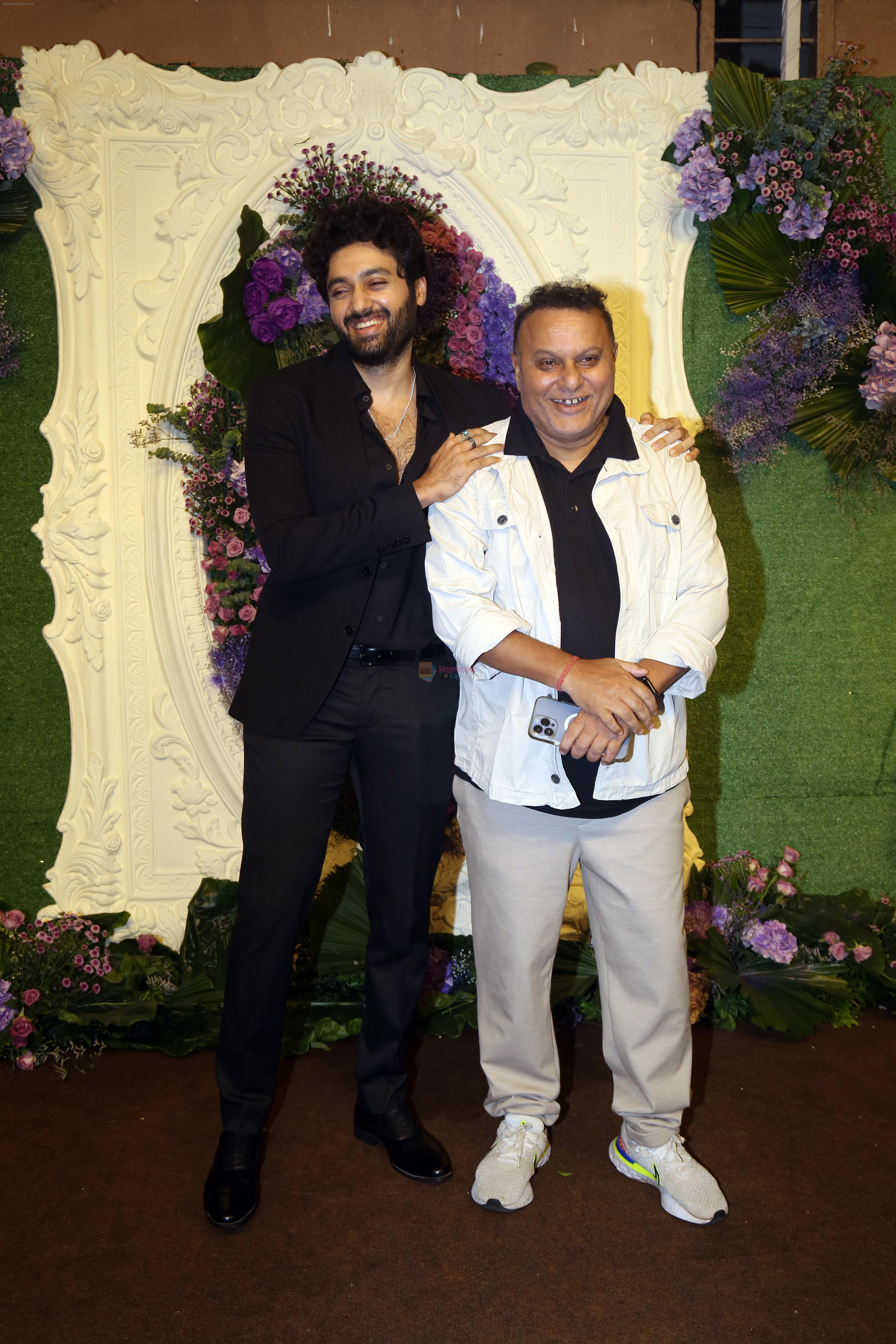 Anil Sharma with son Utkarsh Pose for media at the reception of Karan ...
