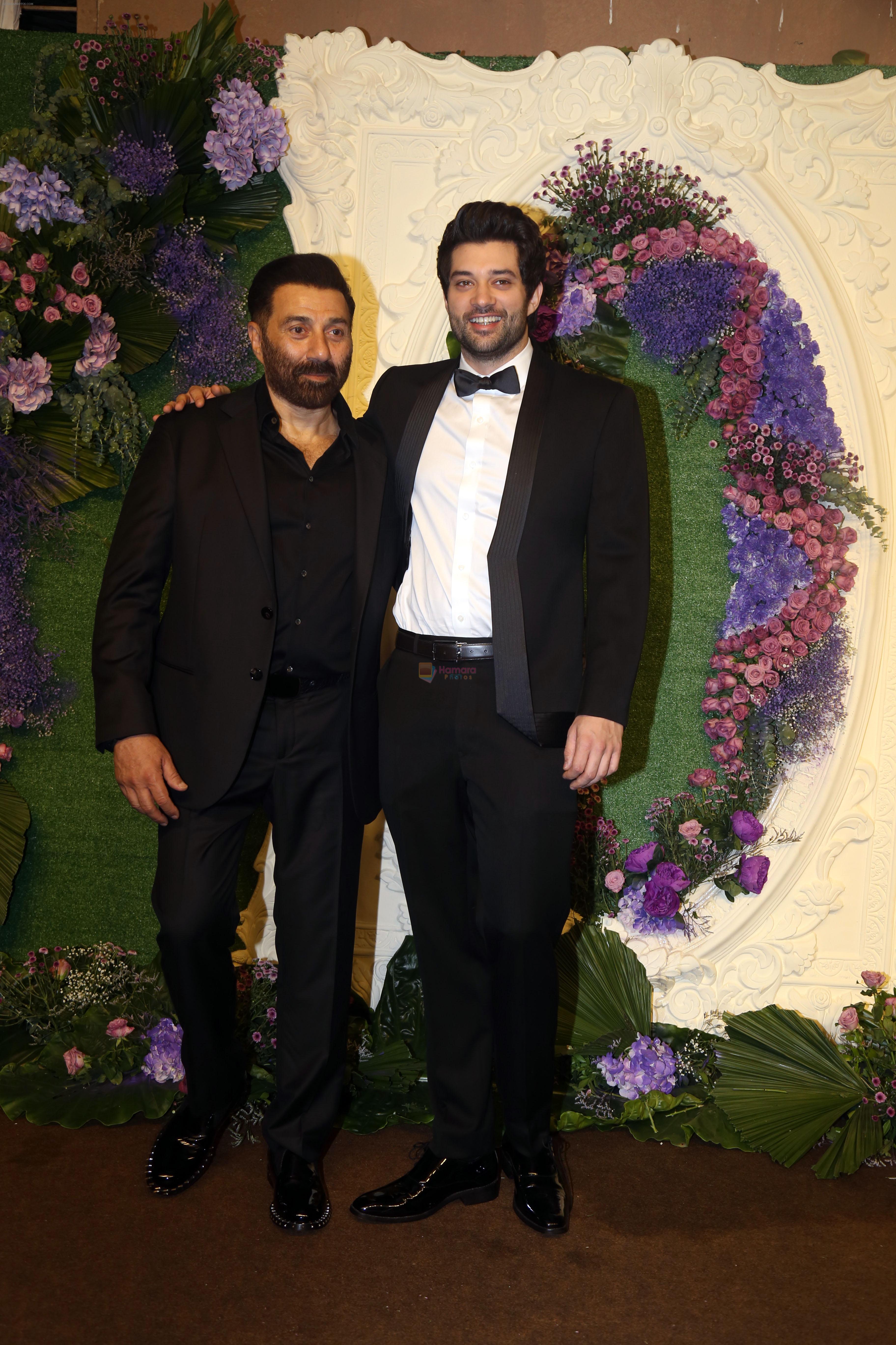 Sunny Deol and Rajveer Deol Pose for media at the reception of Karan ...