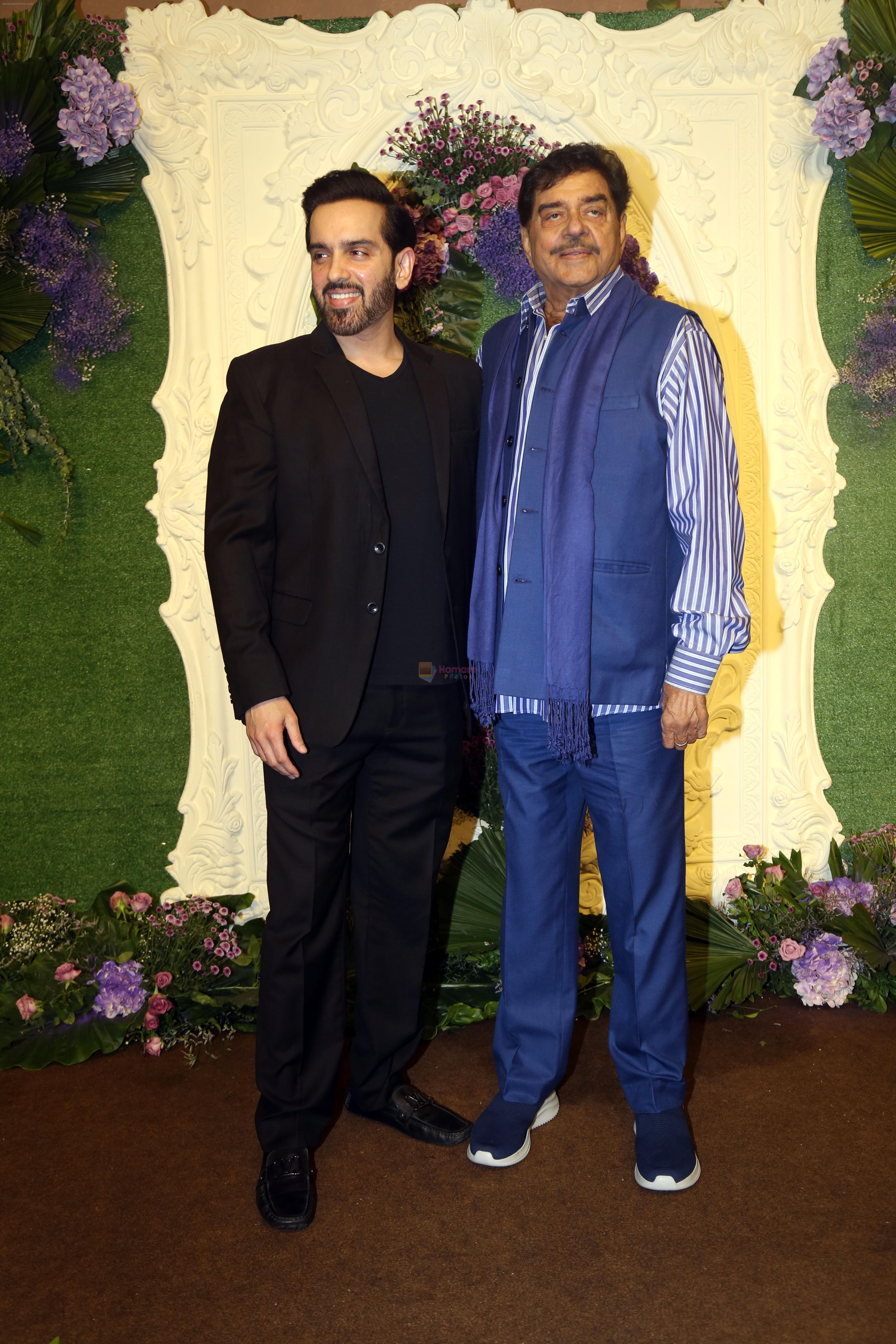 Luv Sinha and Shatrughan Sinha Pose for media at the reception of Karan ...