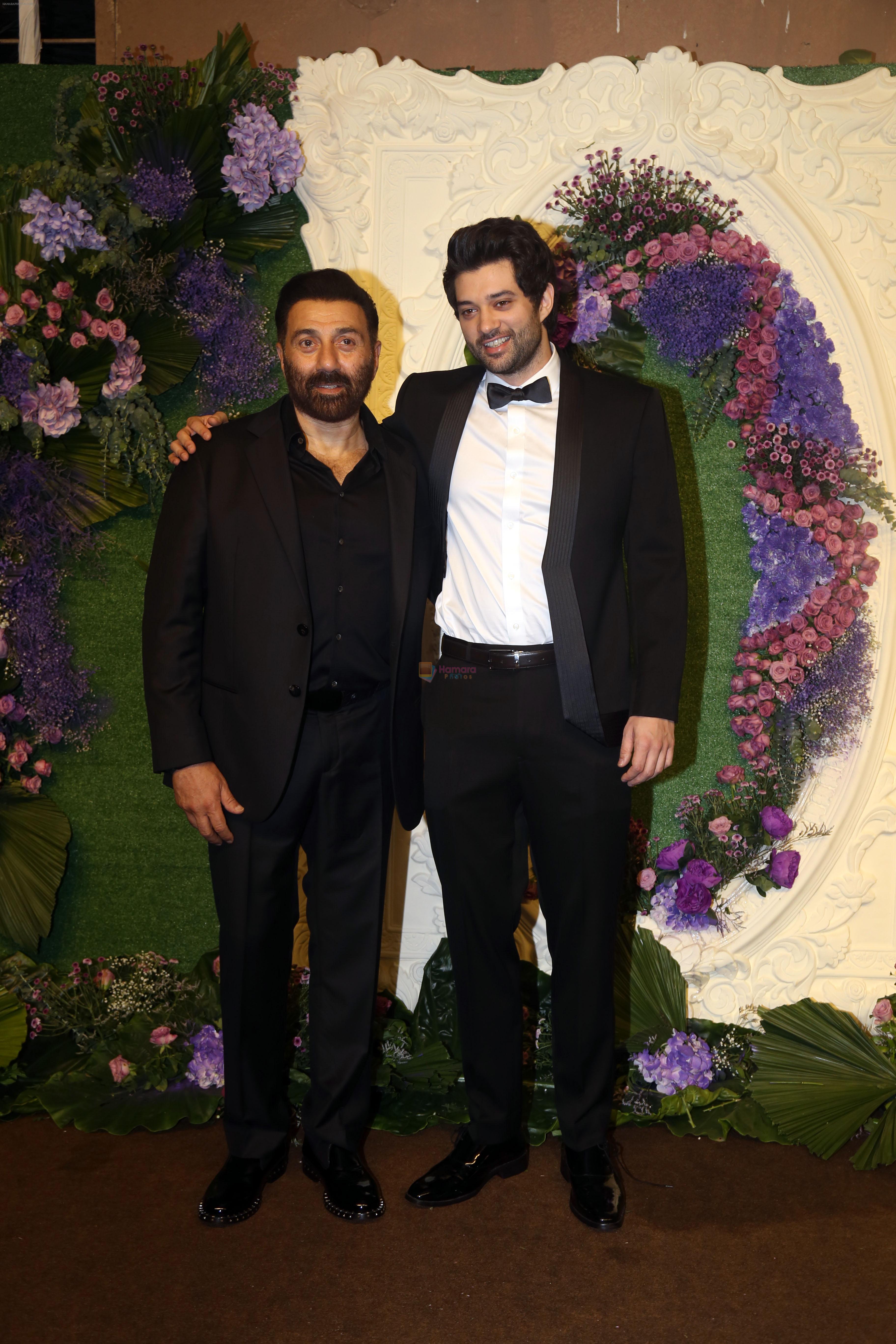 Sunny Deol and Rajveer Deol Pose for media at the reception of Karan ...