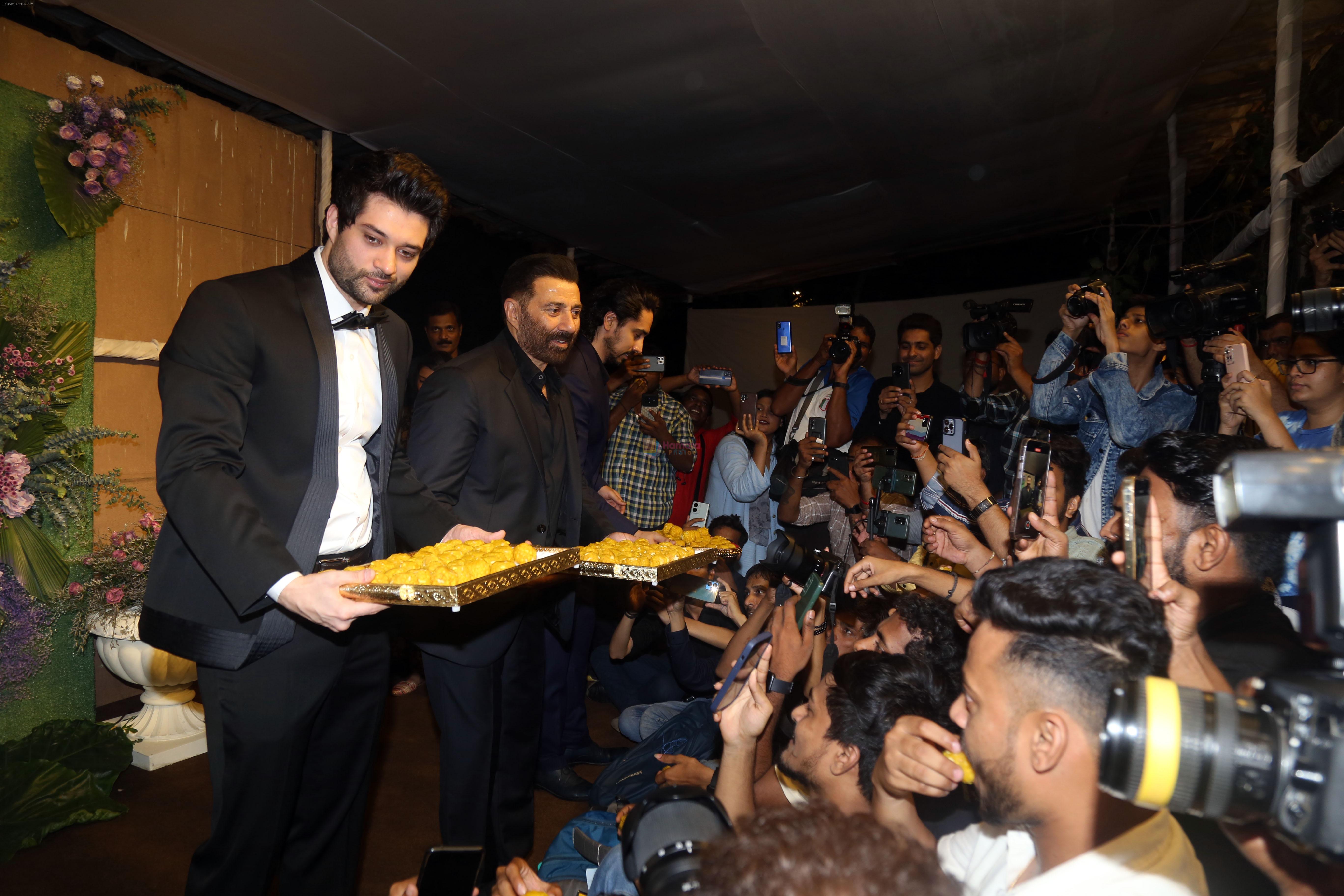 Sunny Deol and Rajveer Deol Pose for media at the reception of Karan ...