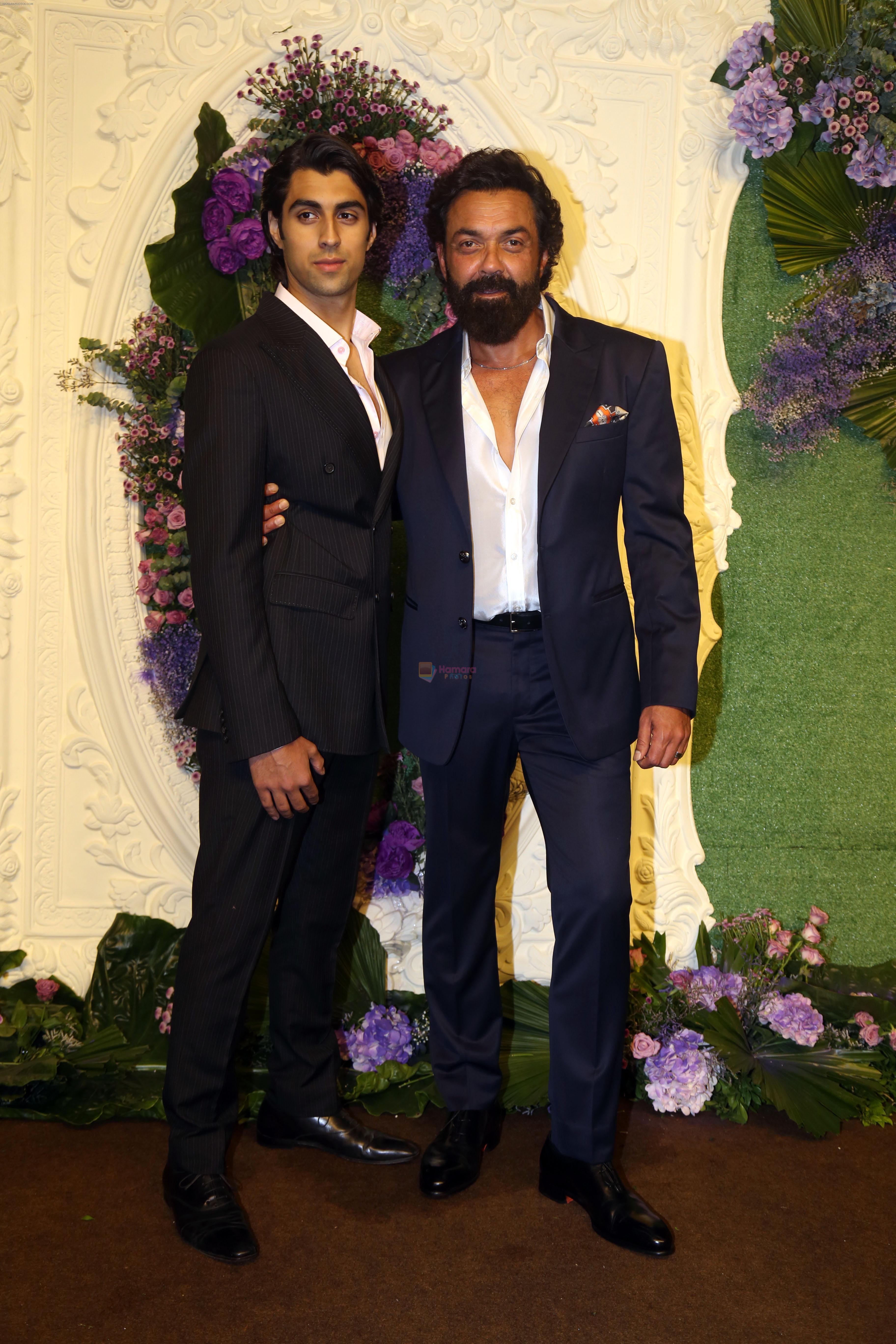 Bobby Deol with son Aryaman Pose for media at the reception of Karan ...